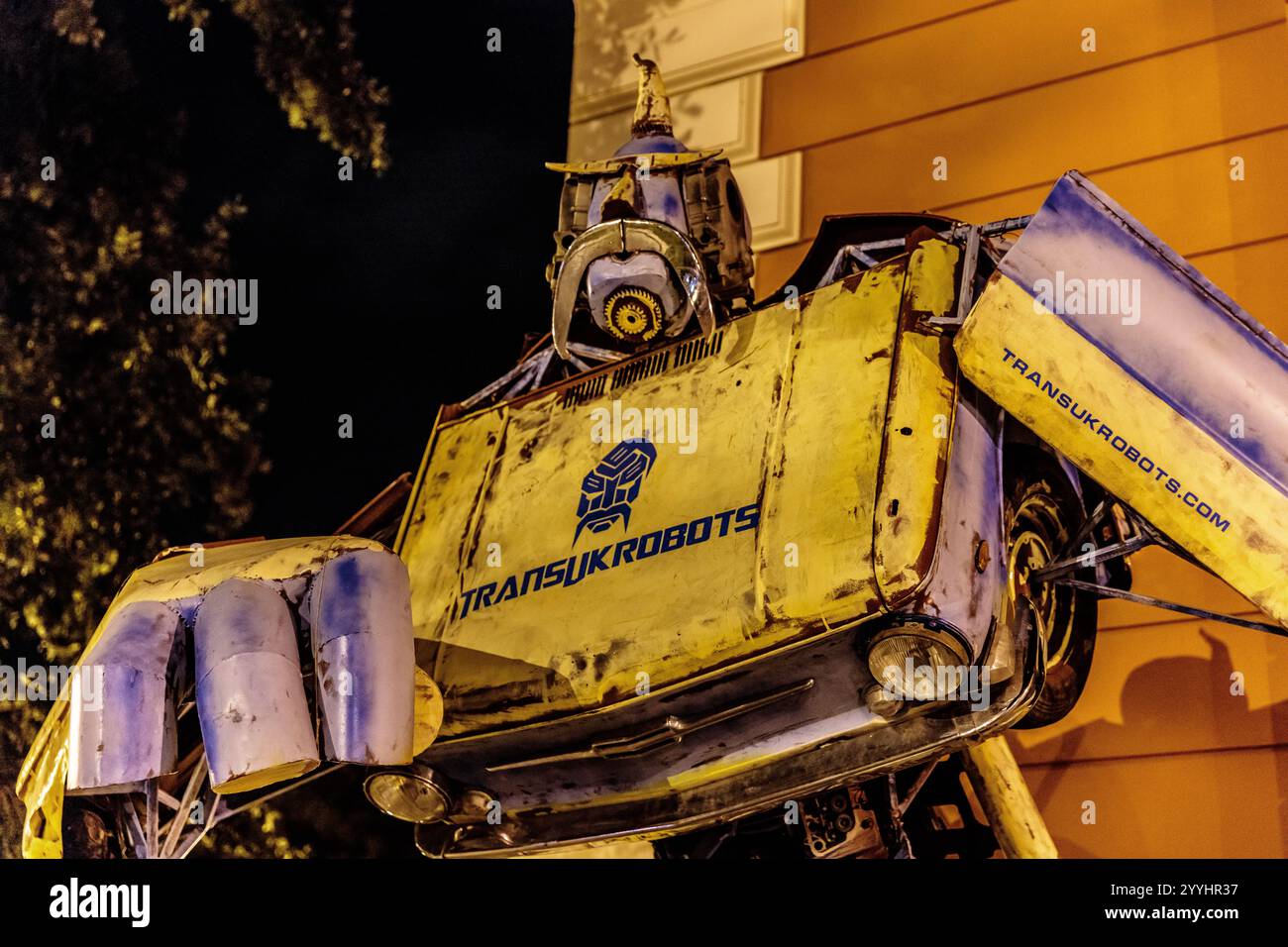 A robot made of a car with the word Transukrobots on it. The robot is ...