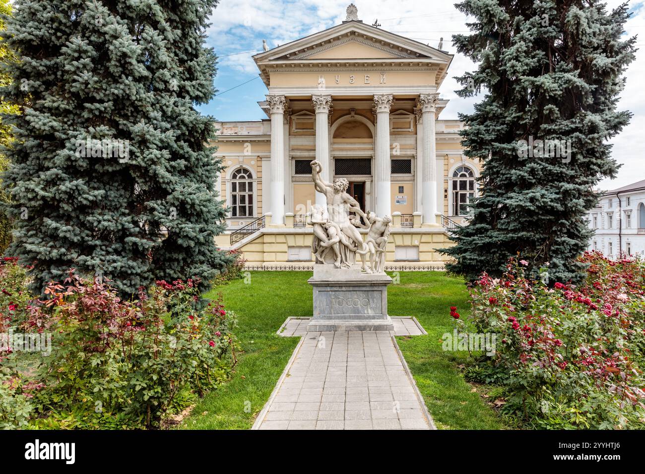 A large building with statues of people and animals in front of it. The ...