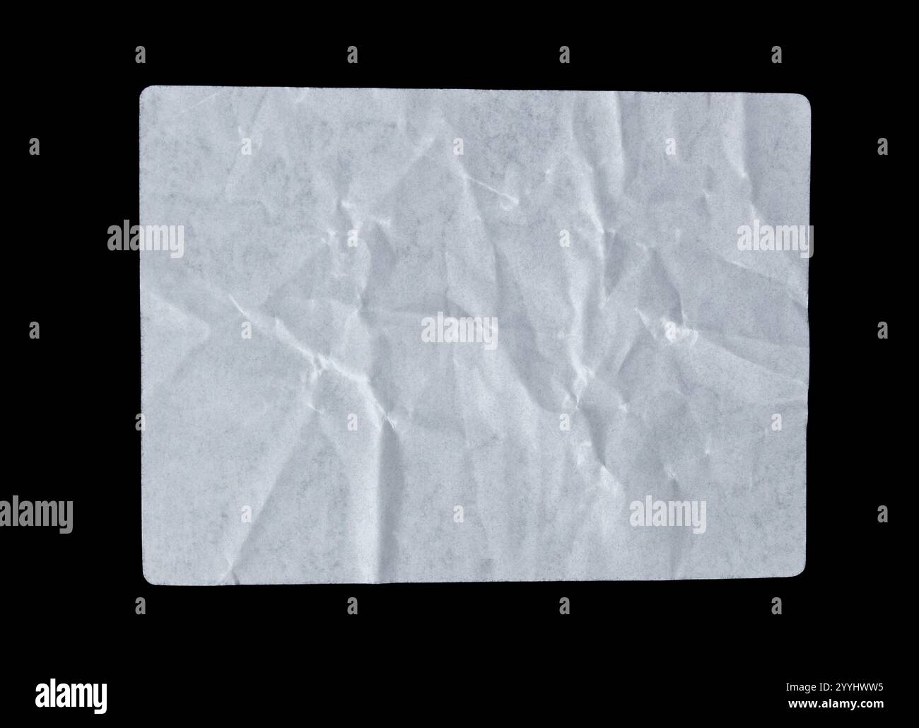 White adhesive glued creased paper sticker label isolated on black ...