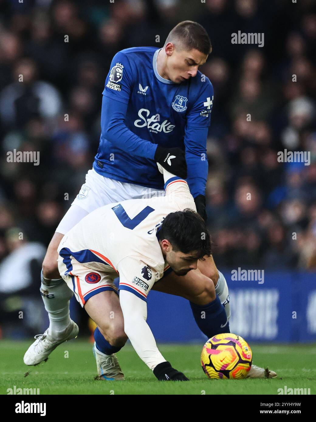 Vitaliy Mykolenko of Everton tackles Pedro Neto of Chelsea during the ...