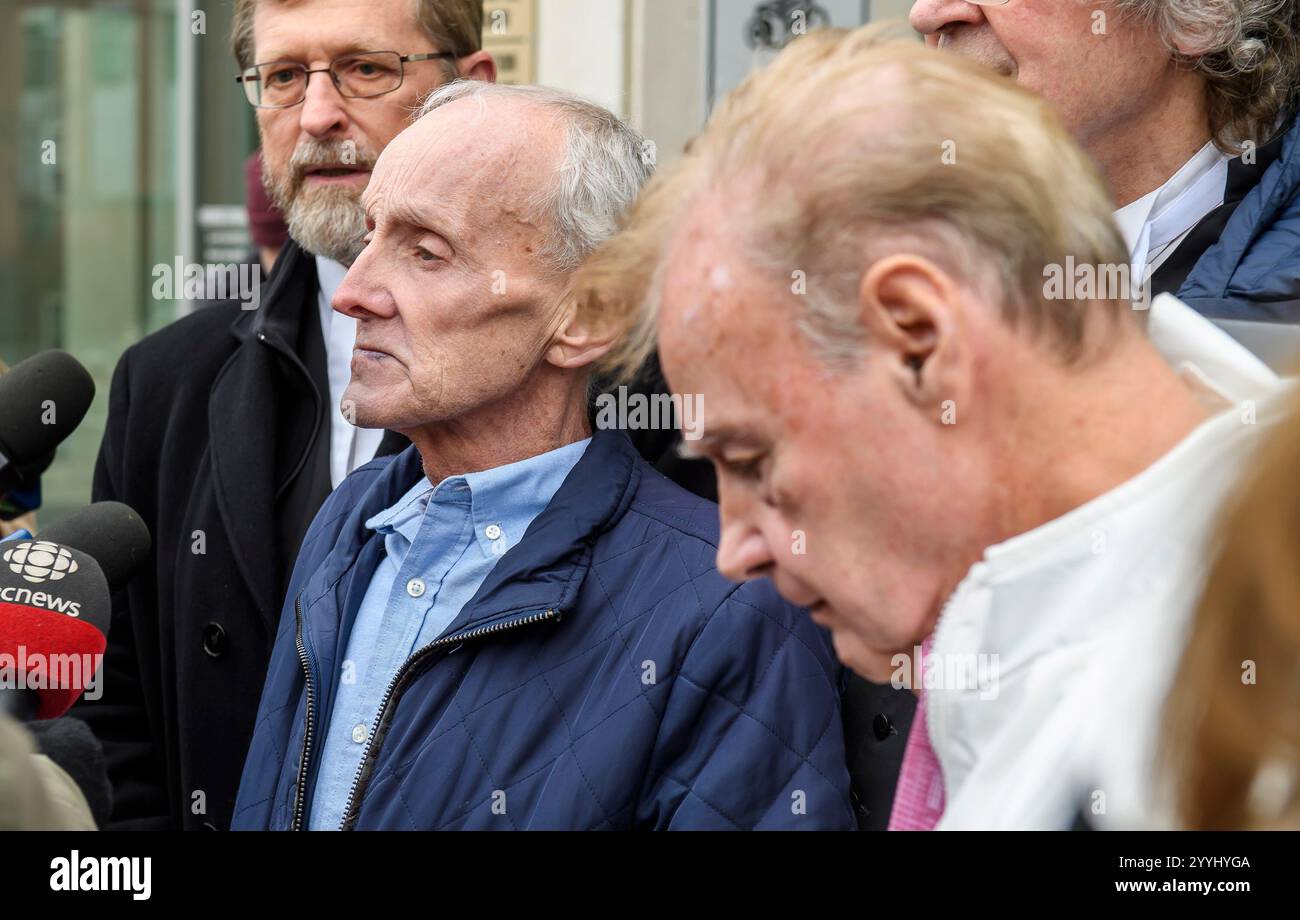 Robert Mailman, left, and Walter Gillespie, speak to media shortly ...