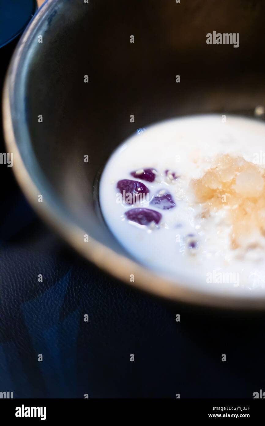 Close up Thai glutinous rice balls with coconut milk Stock Photo - Alamy