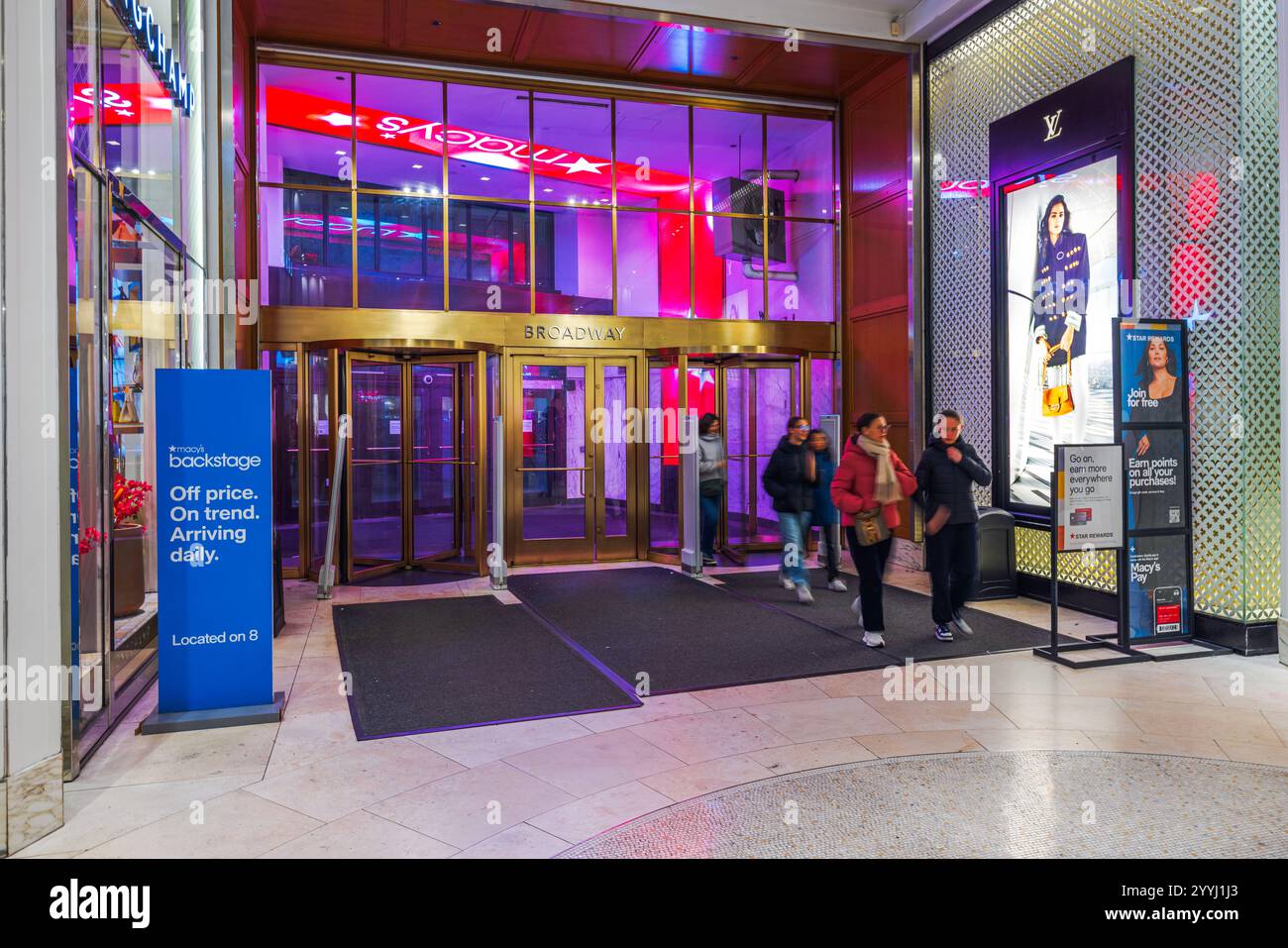 Entrance to Macy's Broadway location featuring illuminated signage ...