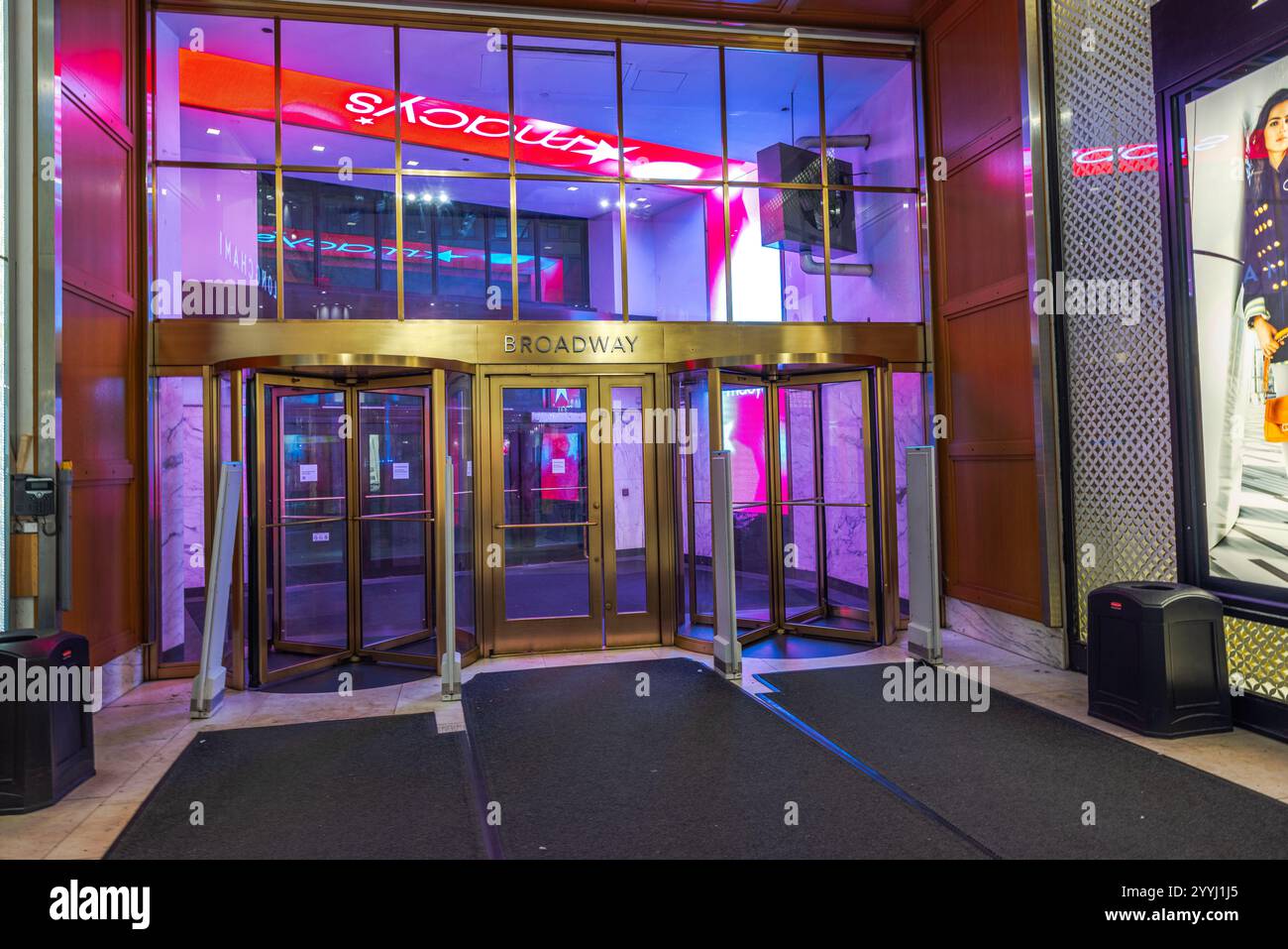 Entrance to Macy's Broadway store with illuminated signage, revolving ...