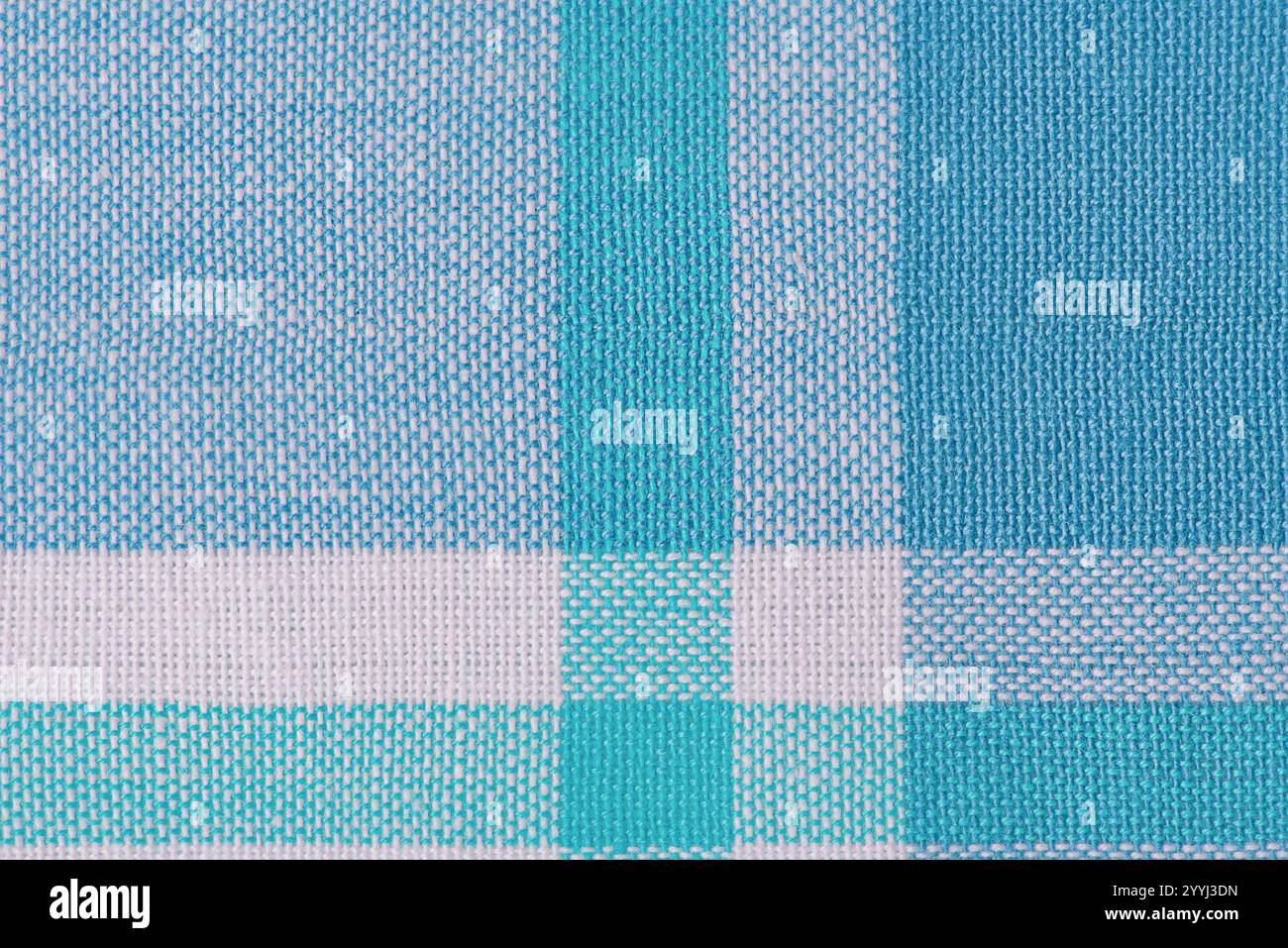 Light and dark blue checkered fabric with white as a background, macro ...