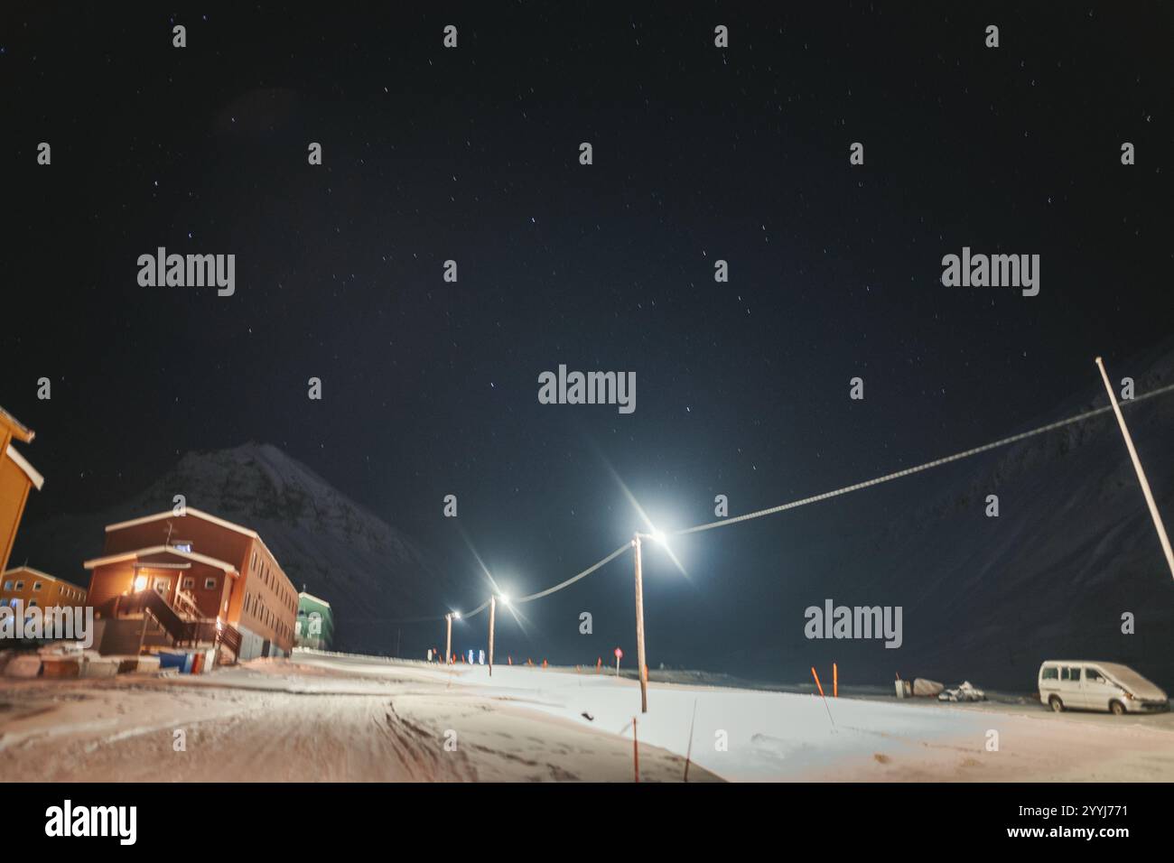 Starry polar night sky over Nybyen street in Longyearbyen, Svalbard ...