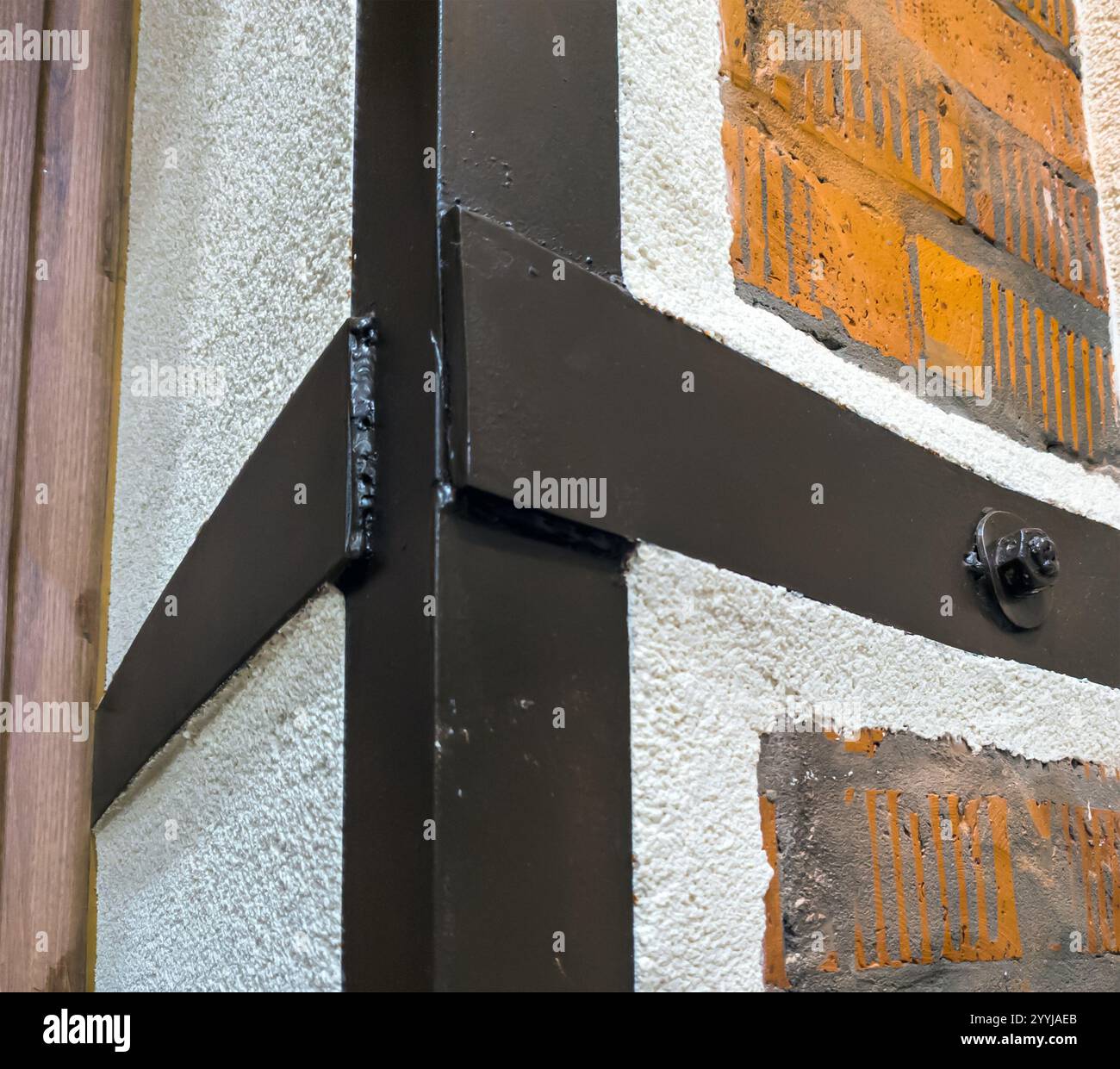 Fragment of a metal reinforcing belt of a doorway in a brick wall Stock ...