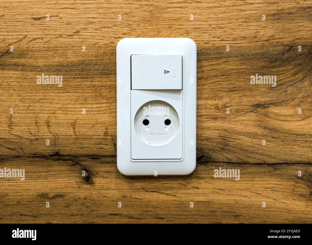Vertical socket block with single-key switch installed in a wooden ...