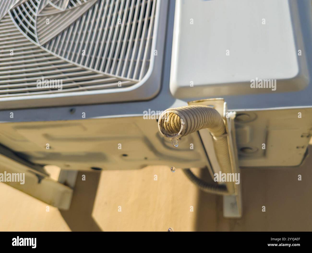 Air conditioner outdoor unit drain pipe outlet Stock Photo - Alamy