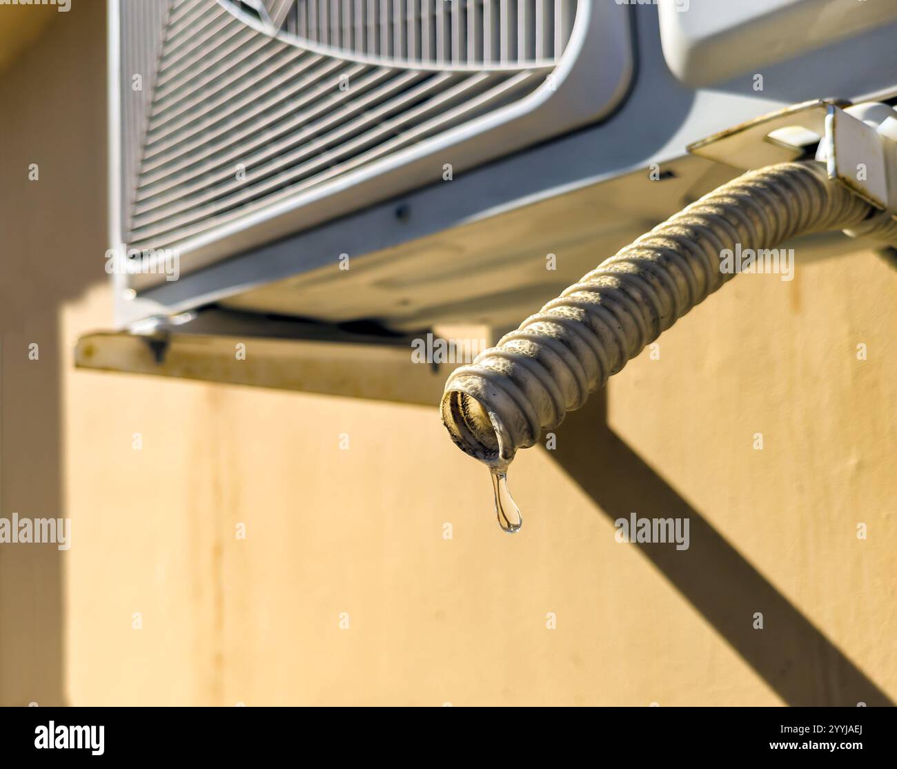 Condensation dripping from air conditioner drain pipe Stock Photo - Alamy