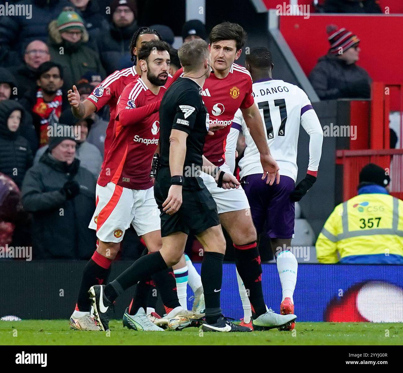 Manchester, UK. 22nd Dec, 2024. Bruno Fernandes of Manchester United and Harry Maguire of ...