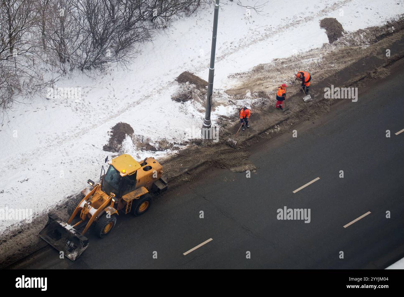 Construction workers in orange uniforms hi-res stock photography and ...