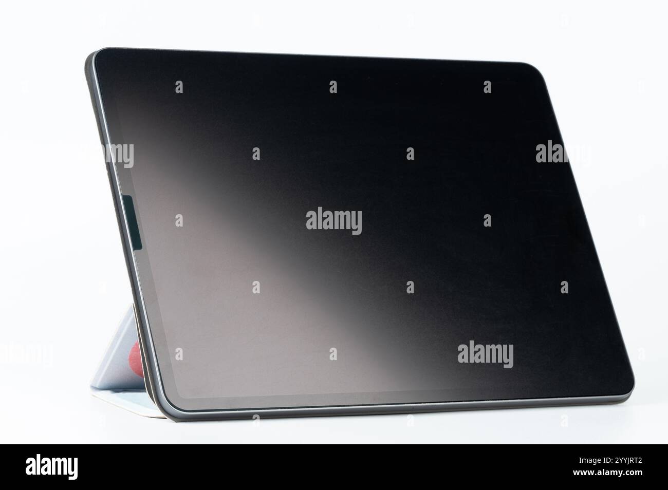 Tablet in horizontal orientation on cover stand isolated studio ...