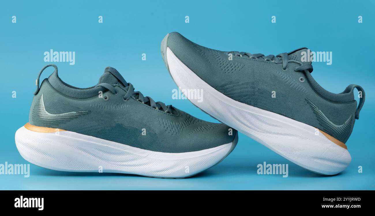 Trainer sport shoes side view isolated on blue studio background Stock ...