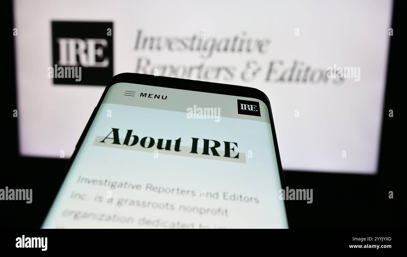 In this photo illustration, a mobile phone with the website of ...