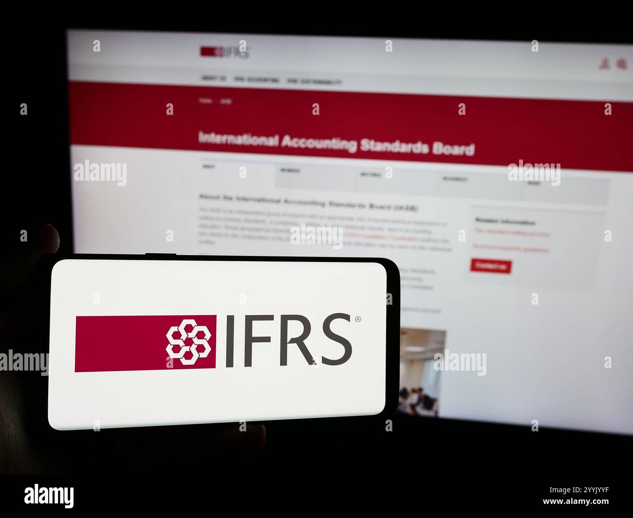 In this photo illustration, a person is holding a smartphone with the ...