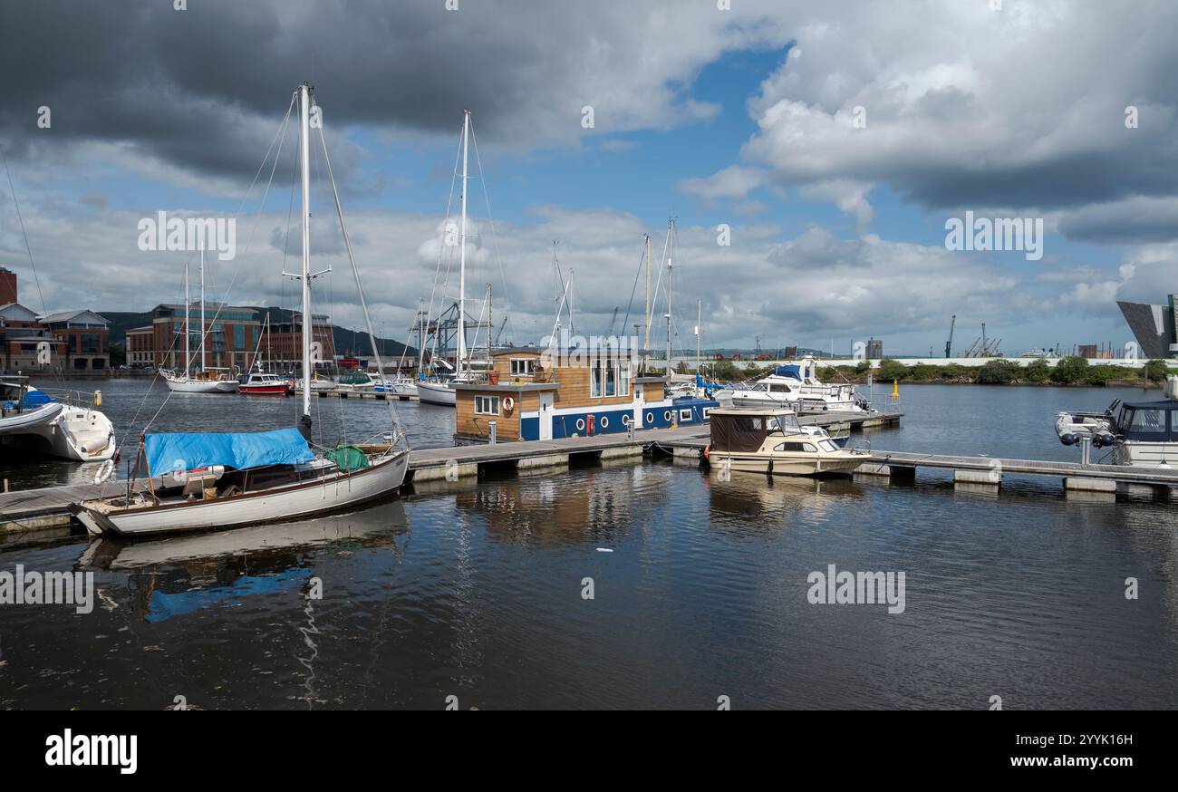 Boats and yachts moored at floating docks on the River Lagan in Belfast ...