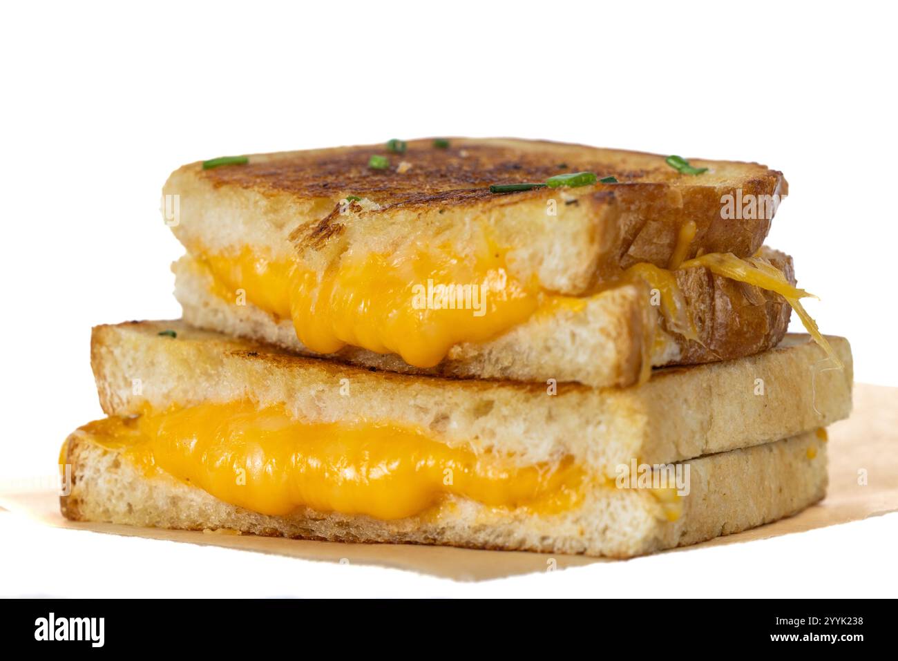 Grilled Cheese with melting cheese dripping from the inside. The ...