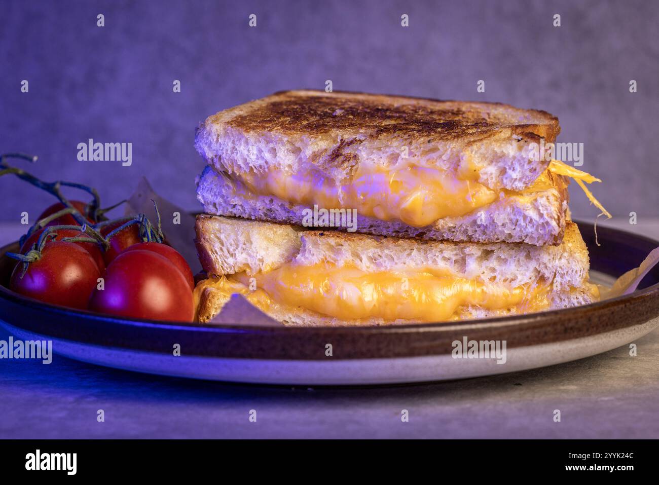 Grilled Cheese with melting cheese dripping from the inside. The ...