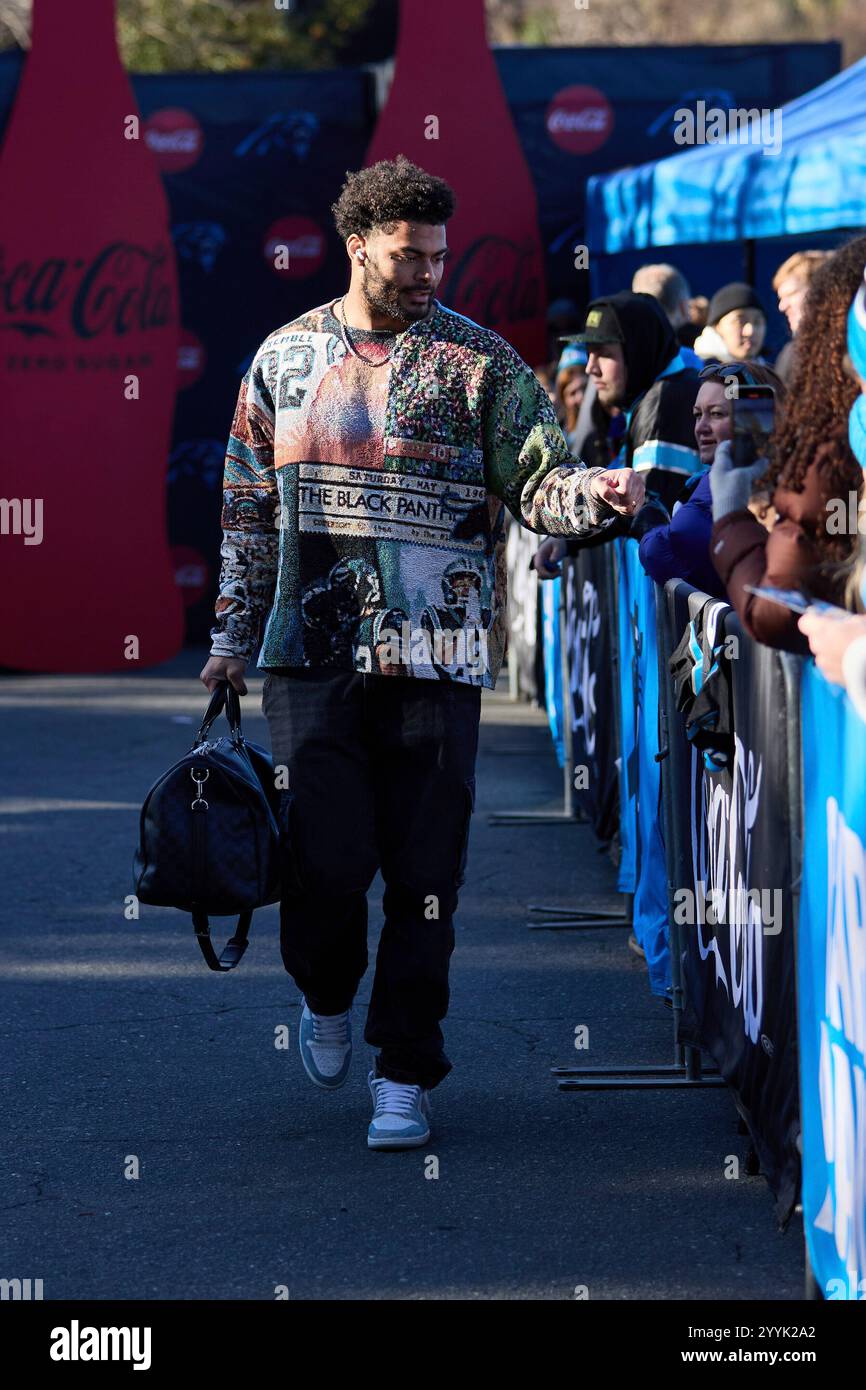 Carolina Panthers tight end Tommy Tremble bumps fists with fans as he ...
