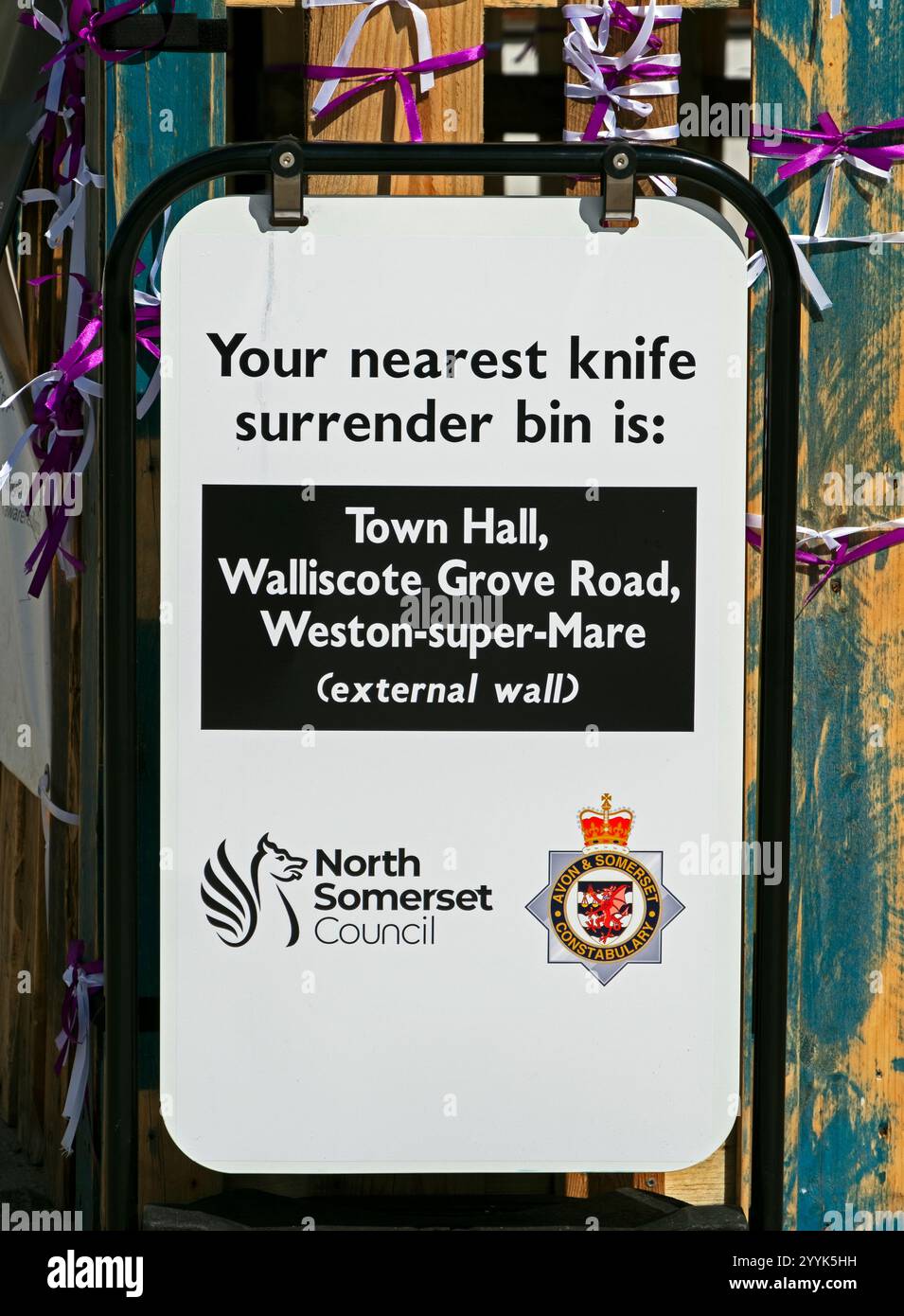 A sign giving directions to the nearest knife surrender bin in Weston ...