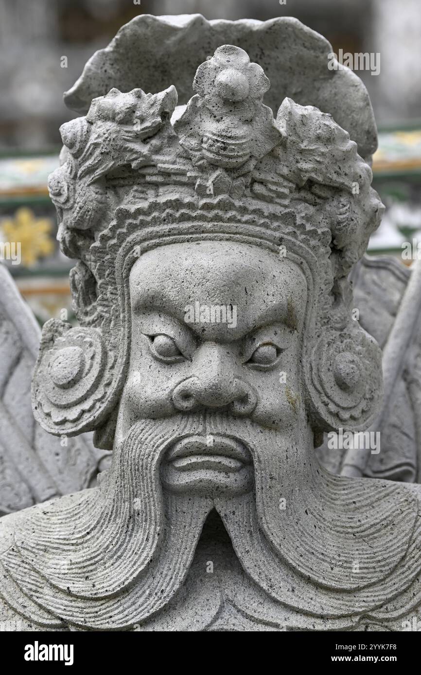 Stone statue of a Chinese warrior, guardian, Wat Arun, Temple of Dawn ...