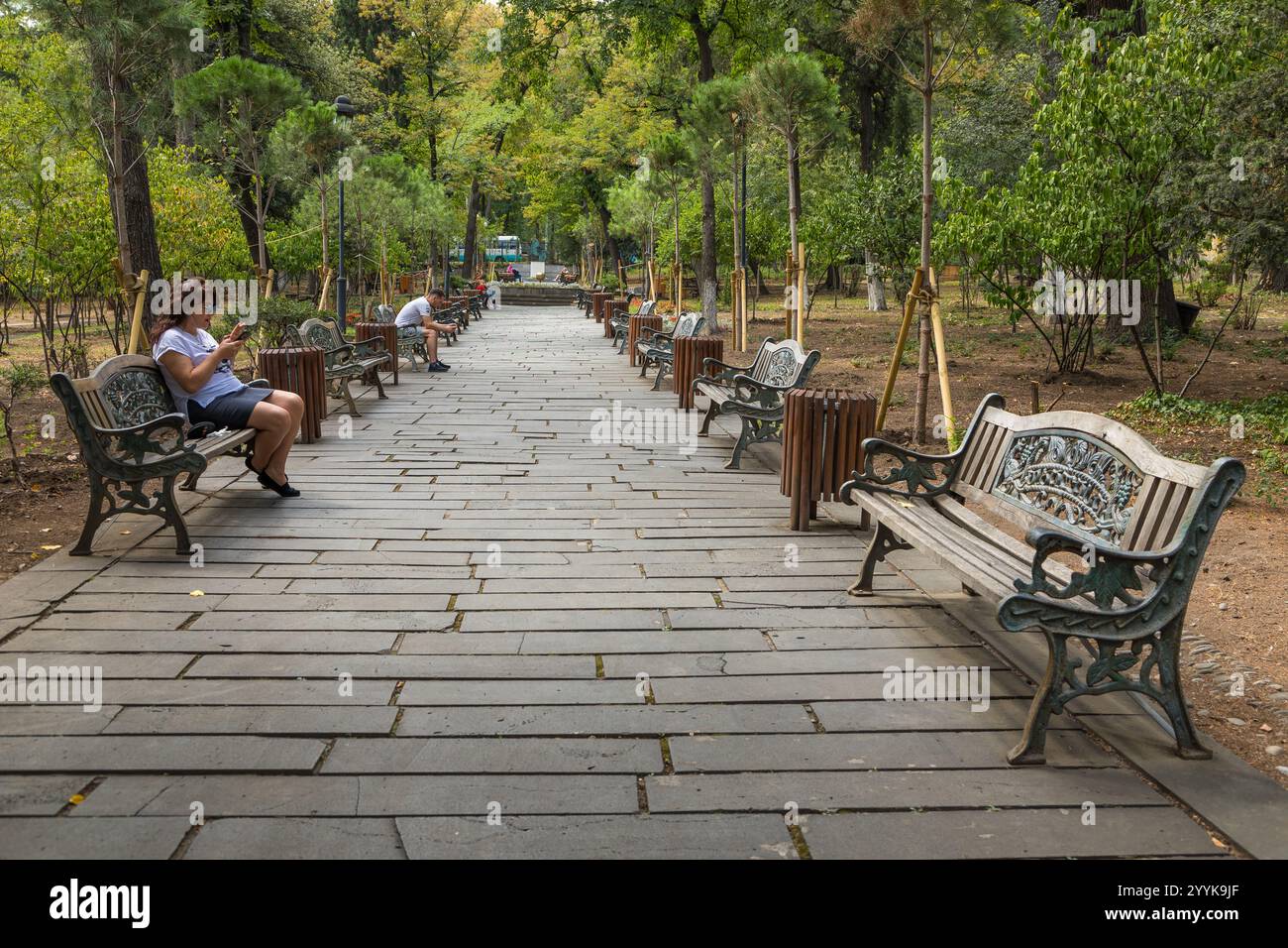Tbilisi, Georgia - 06 Se[tember 2019: People resting on benches in the ...