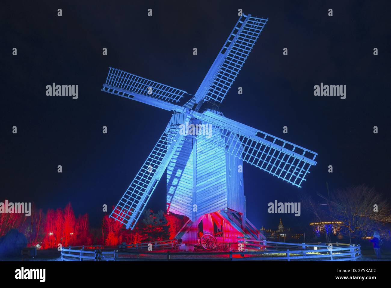 Illuminated windmill with red and blue effects at night, world of ...