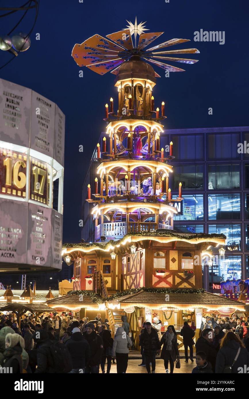 A Christmas pyramid behind the World Time Clock at the Christmas market ...