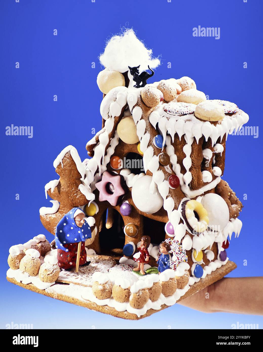 A gingerbread house with Hansel and Gretel, witch's house, Christmas ...