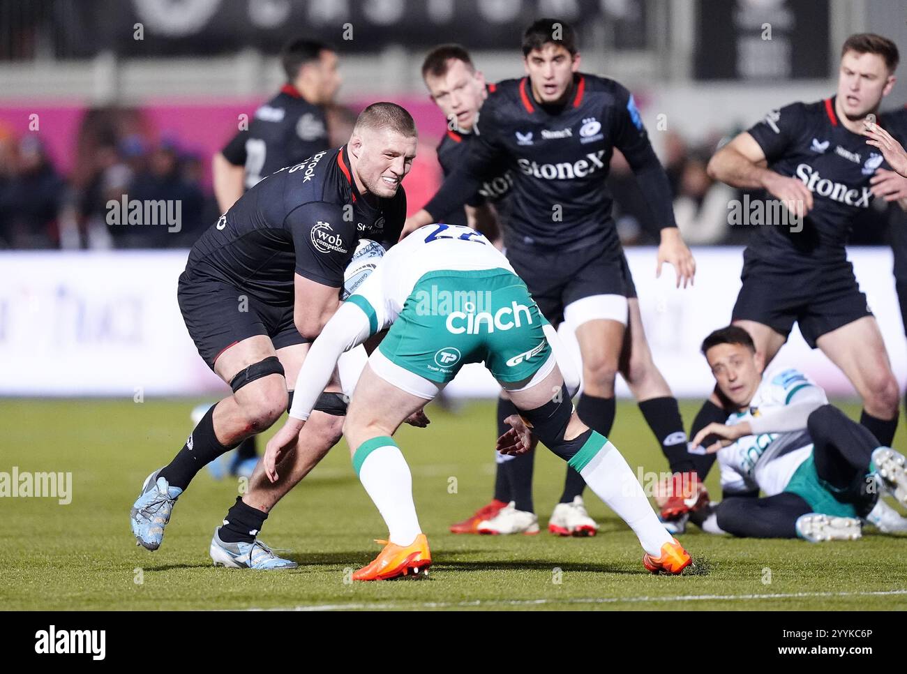Saracens' Tom Willis (left) is tackled by Northampton Saints' Fraser ...
