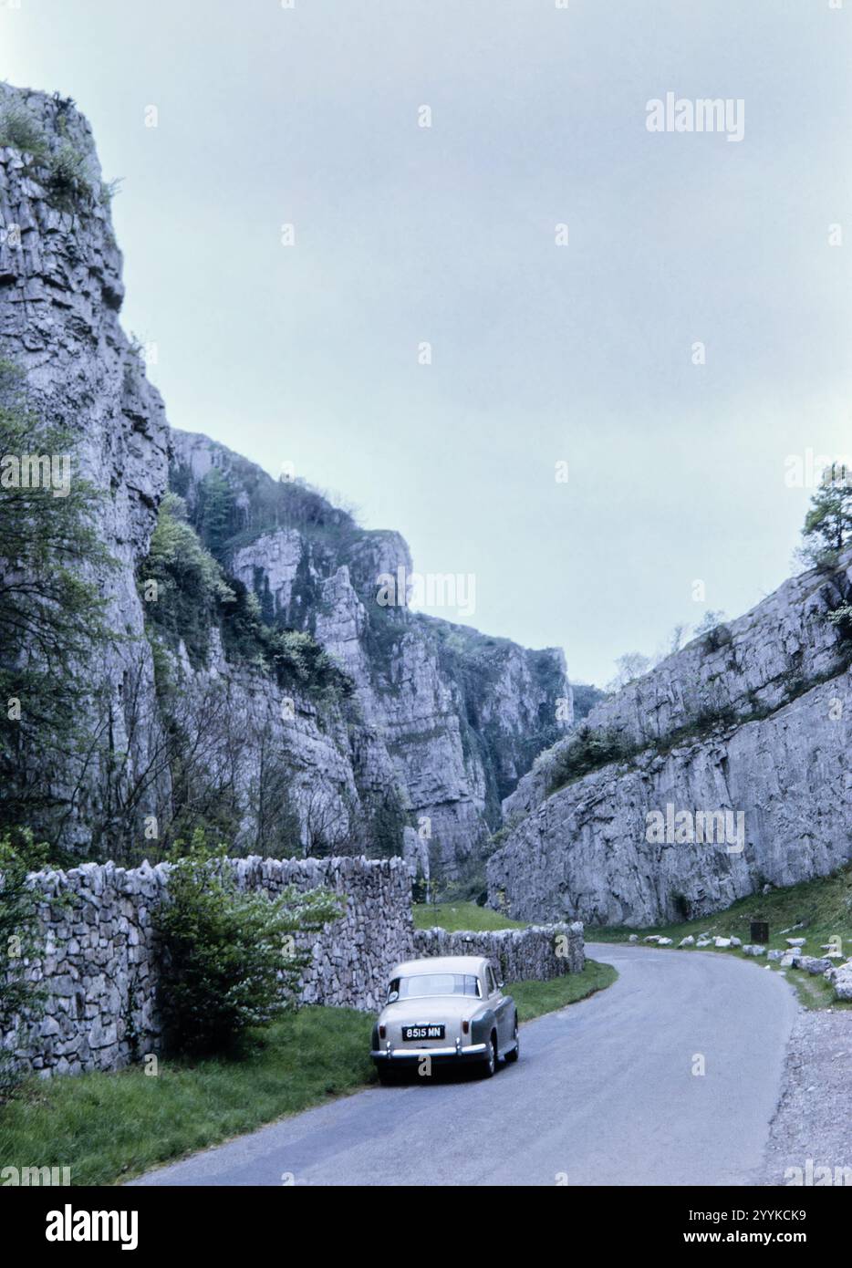 Historical photo of an old Rover car parked on the verge of a country ...