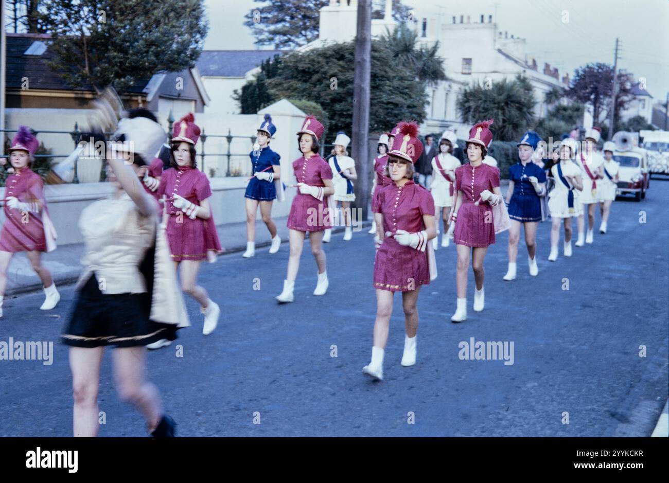 Historical photo of a parade in the 1960s with girls in uniform of drum ...