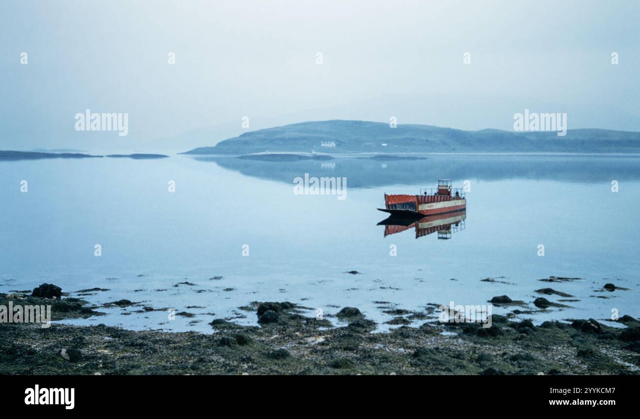 Historical photo of a small drive on ferry boat moored in a loch in ...