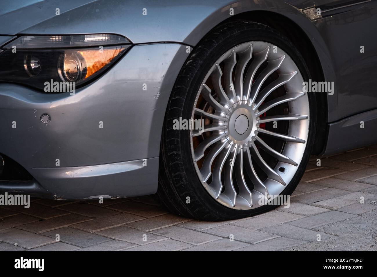 Flat tire on truck on cement, close up. Car wheel flat tire on the road ...