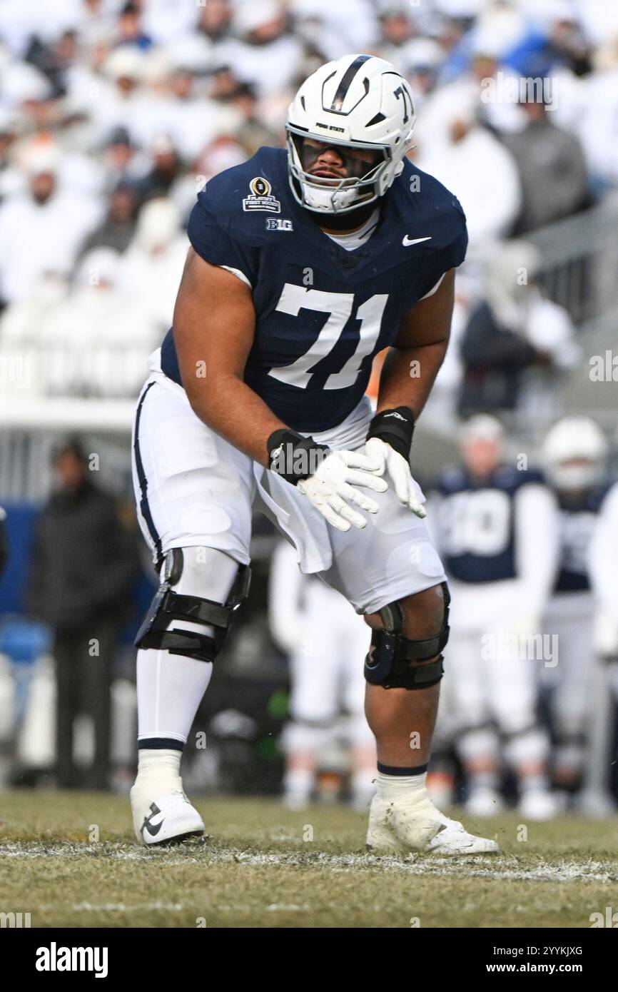 Penn State offensive lineman Olaivavega Ioane #71 looks for someone to ...