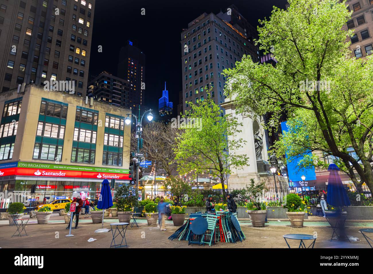 Night view of Herald Square in New York City with illuminated ...