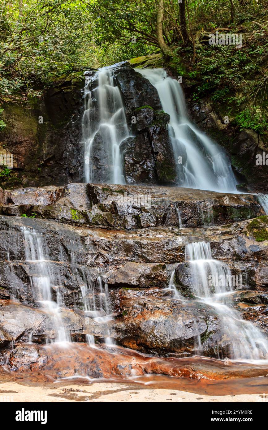 A waterfall with a lot of water coming out of it. The water is clear ...