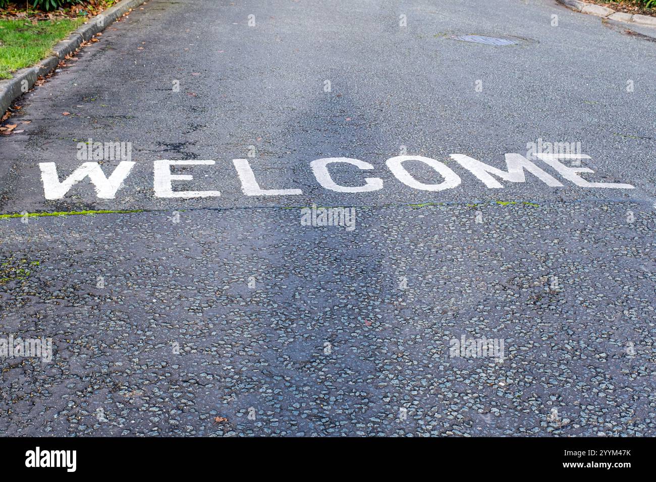 Welcome sign painted on tarmac UK Stock Photo - Alamy