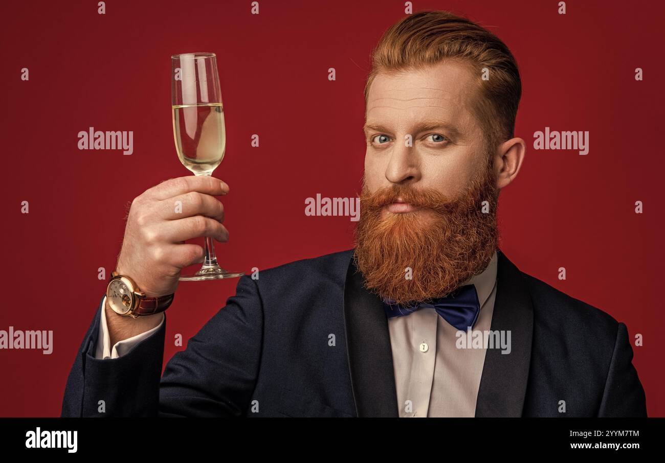 Celebrate with champagne. Cheering and celebrating. Elegant tuxedo man ...