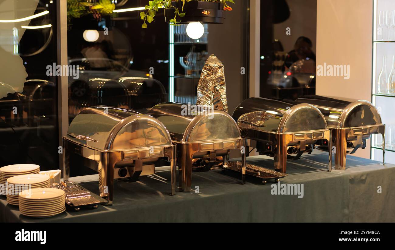 A contemporary hotel dining area featuring a sleek buffet setup and ...