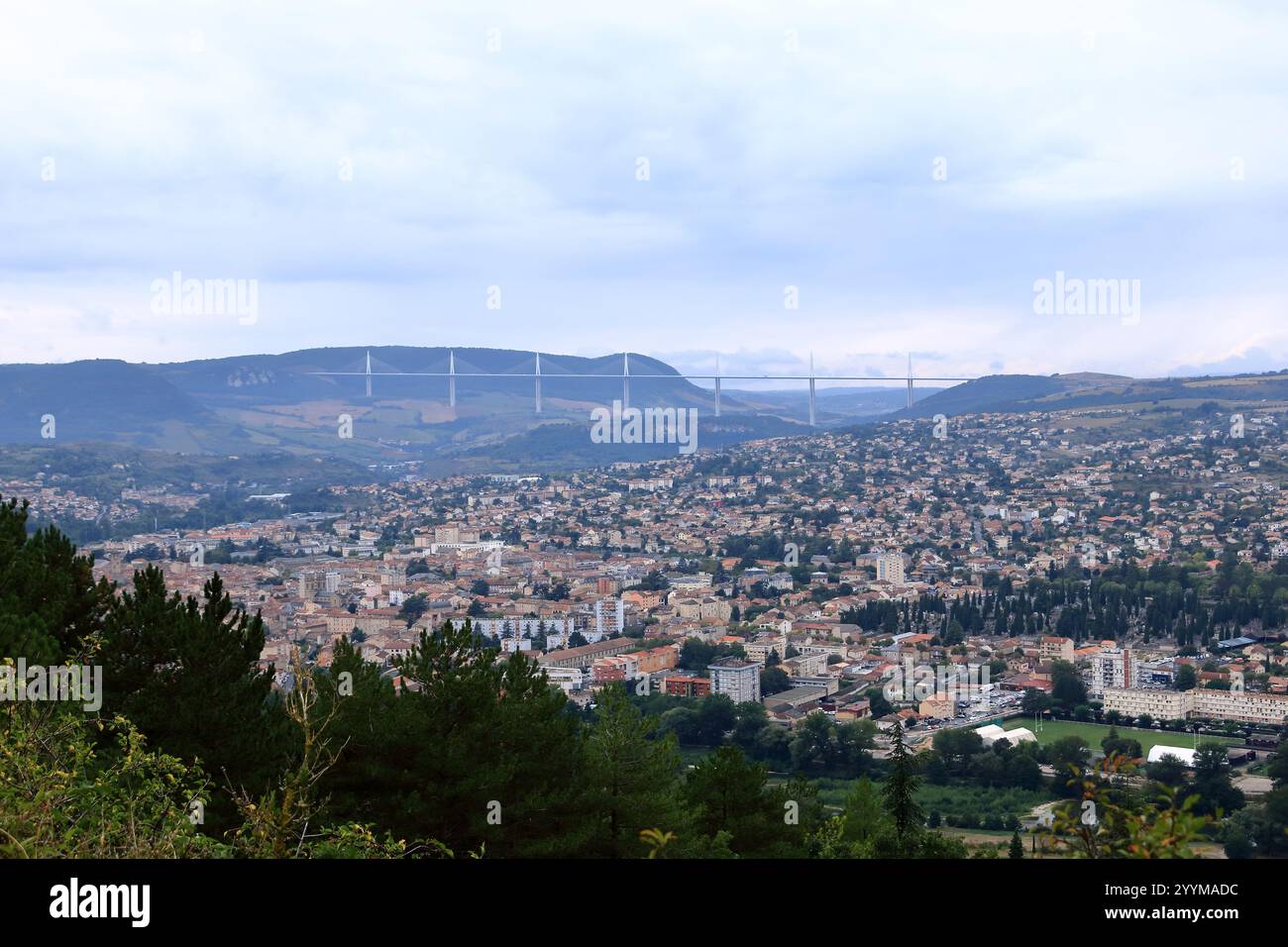 aerial view over the city of Millau with the Viaduct in the background ...