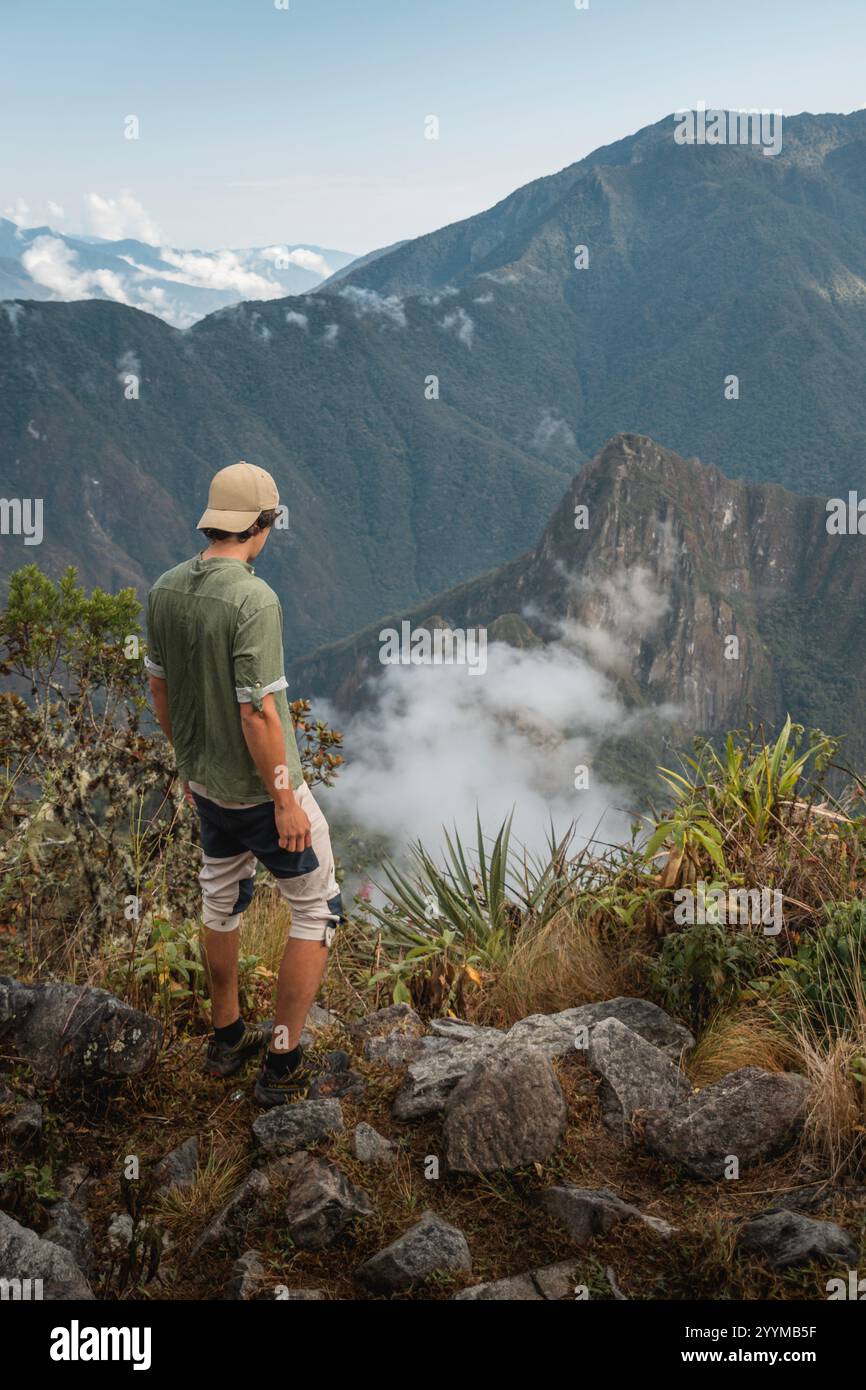 Hiker Overlooking Machu Picchu in the Misty Andes of Peru Stock Photo ...