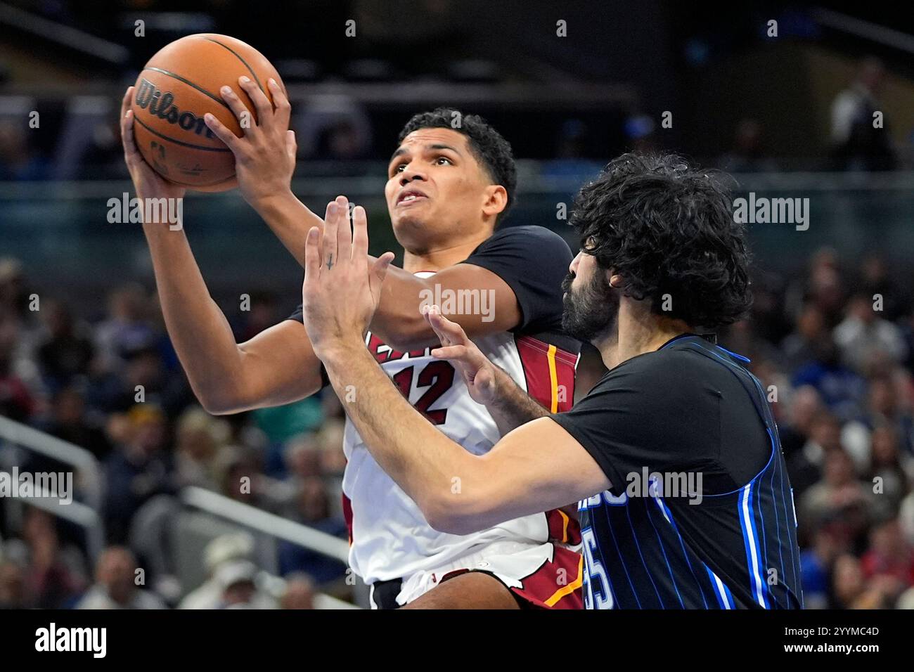 Miami Heat guard Dru Smith, left, makes a shot over Orlando Magic ...