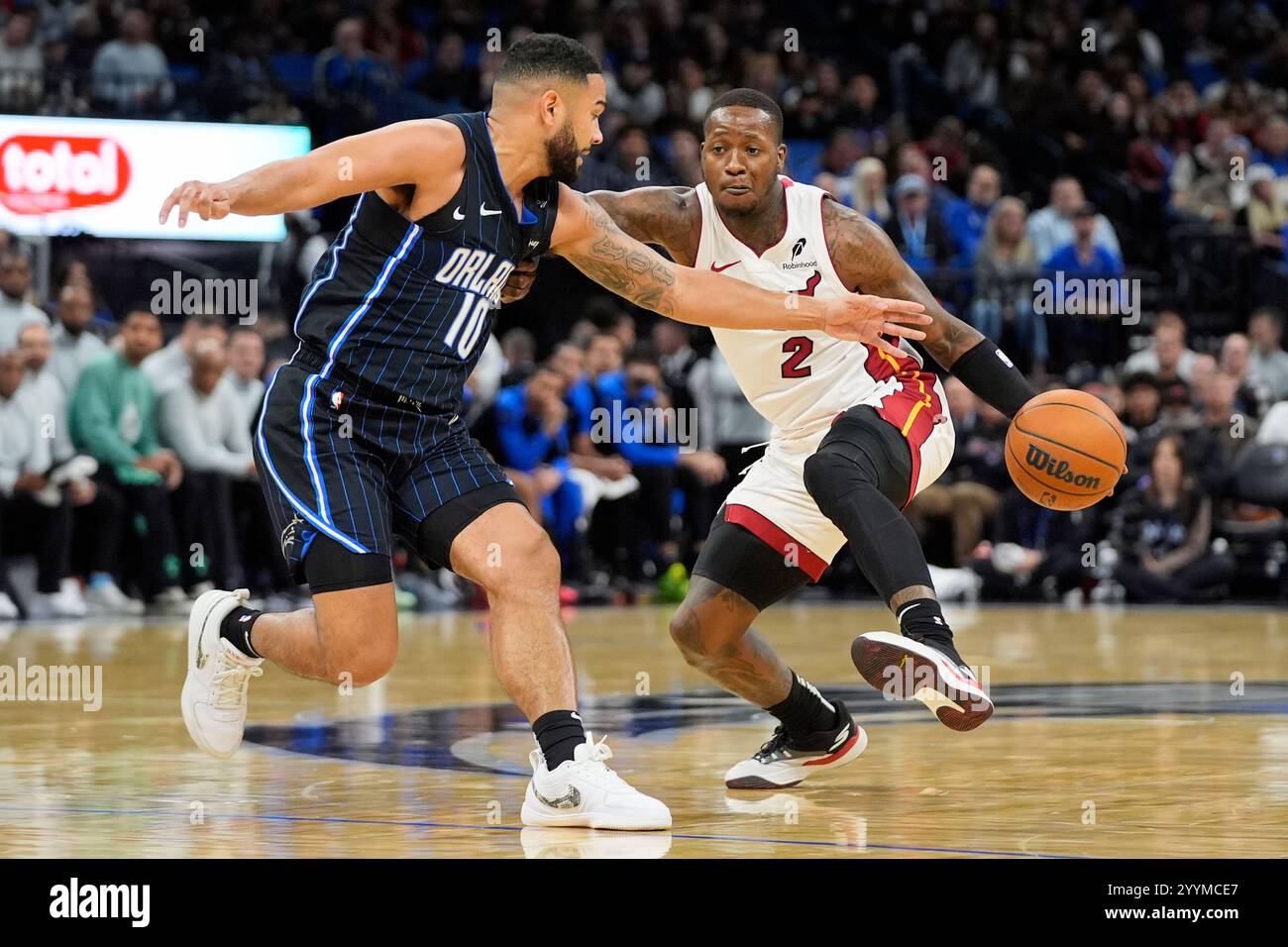 Miami Heat guard Terry Rozier (2) drives around Orlando Magic guard ...