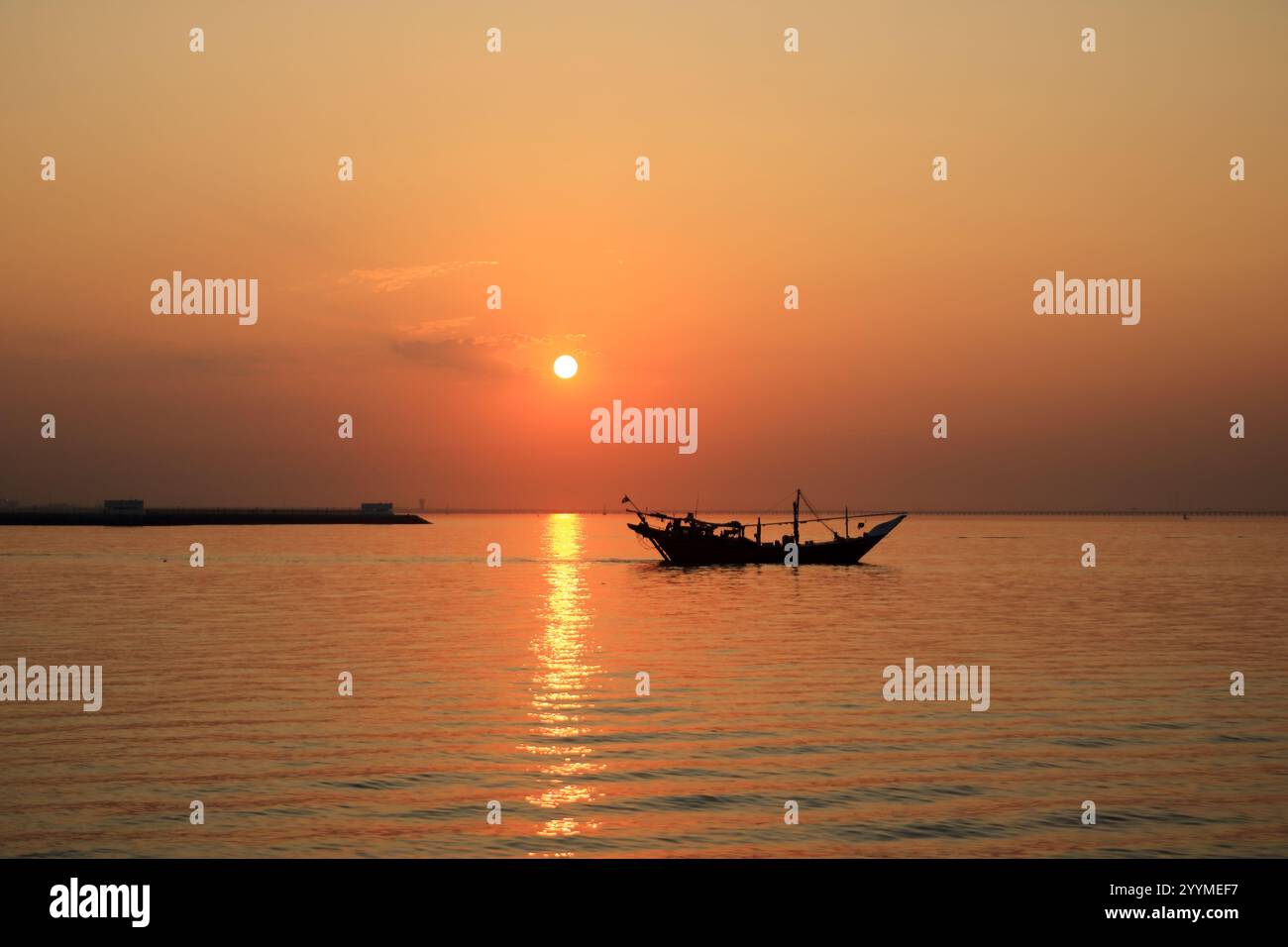 Fishing boat in front of the sunset in Kuwait in Middle East Stock ...