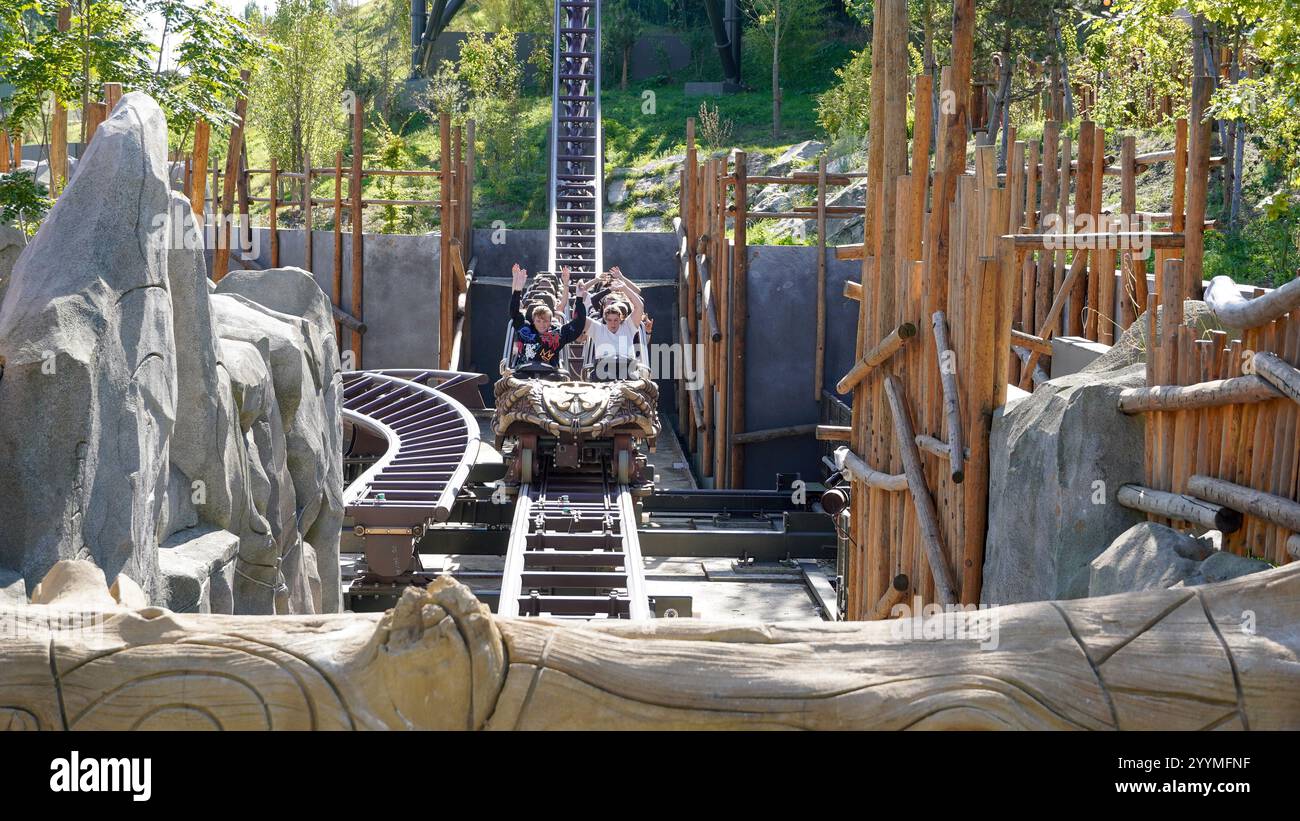 Young people have fun on the "Toutatis" launch roller coaster with a ...