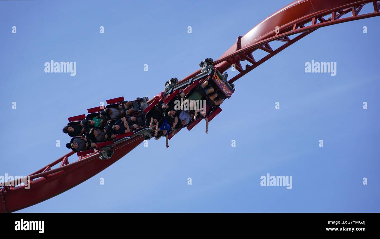 Young people have fun on the overhead element on the extreme catapult ...
