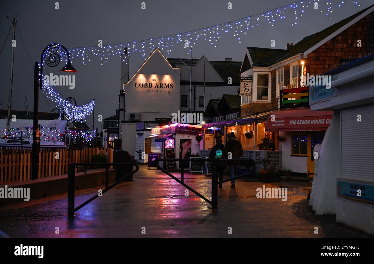 Cobb Arms Lyme Regis at Christmas in the twilight and wet rainy day ...