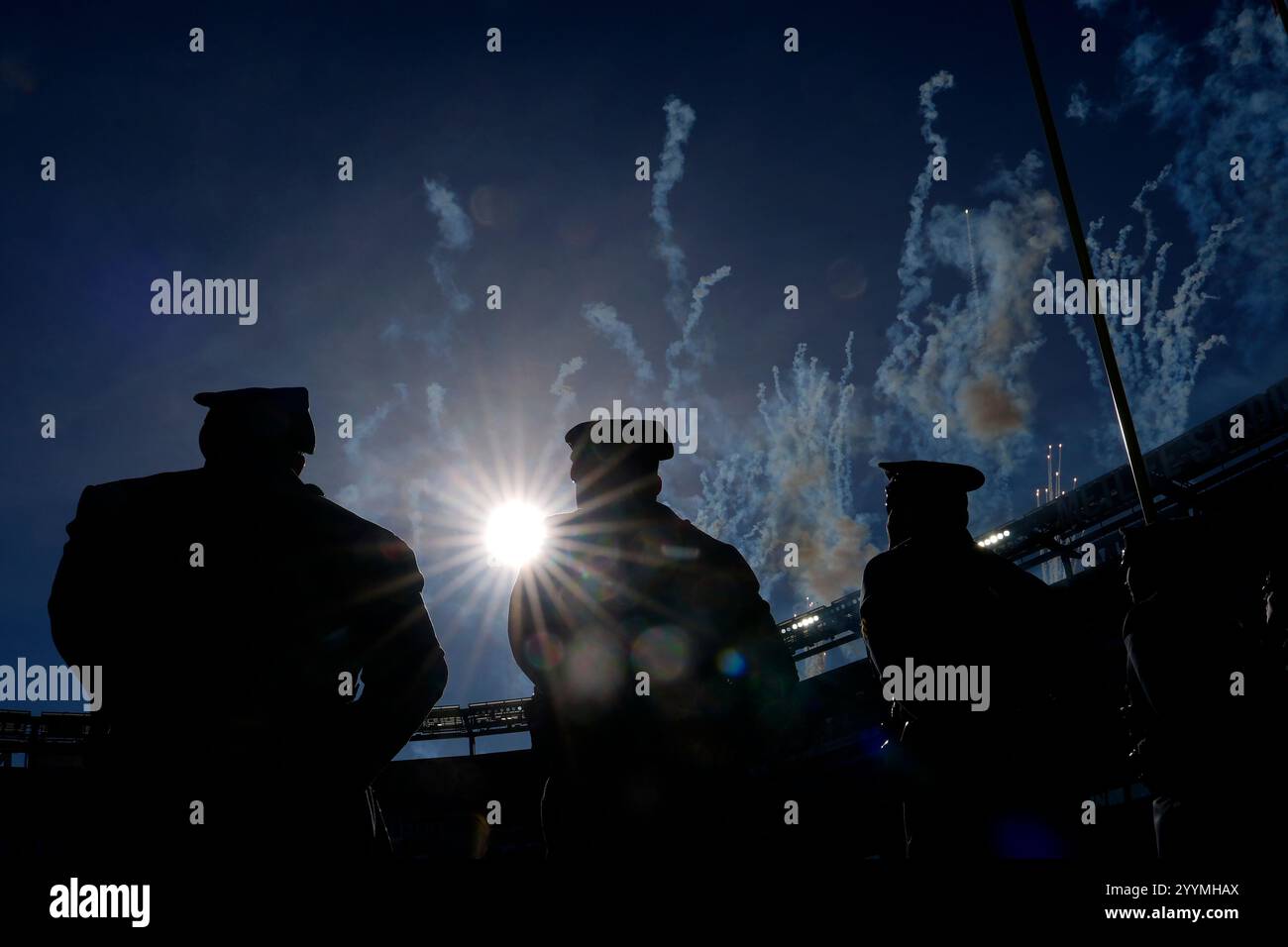 New York State Police officers stand on the field before an NFL ...